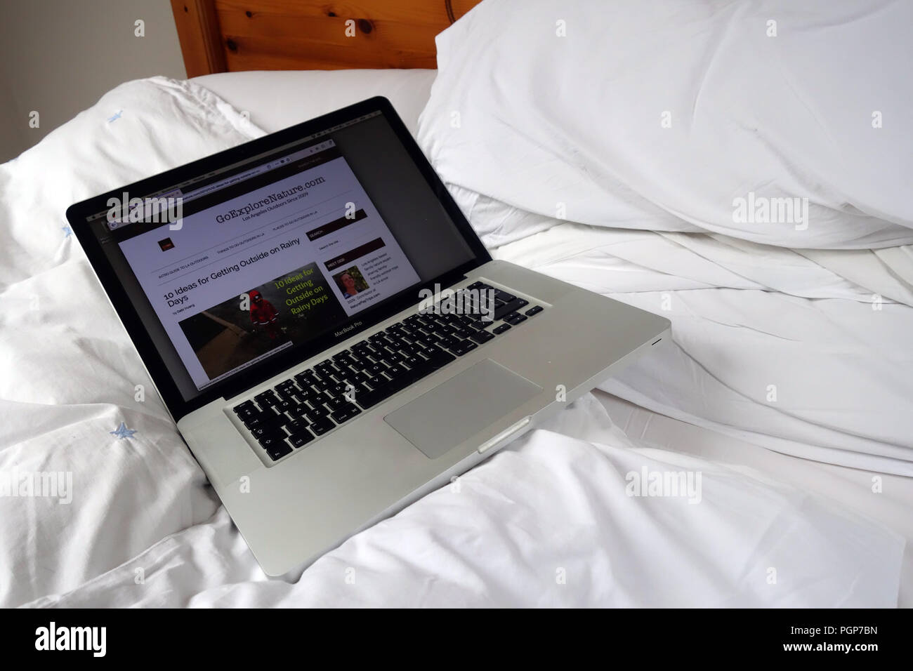 Laptop left on bed hi-res stock photography and images - Alamy