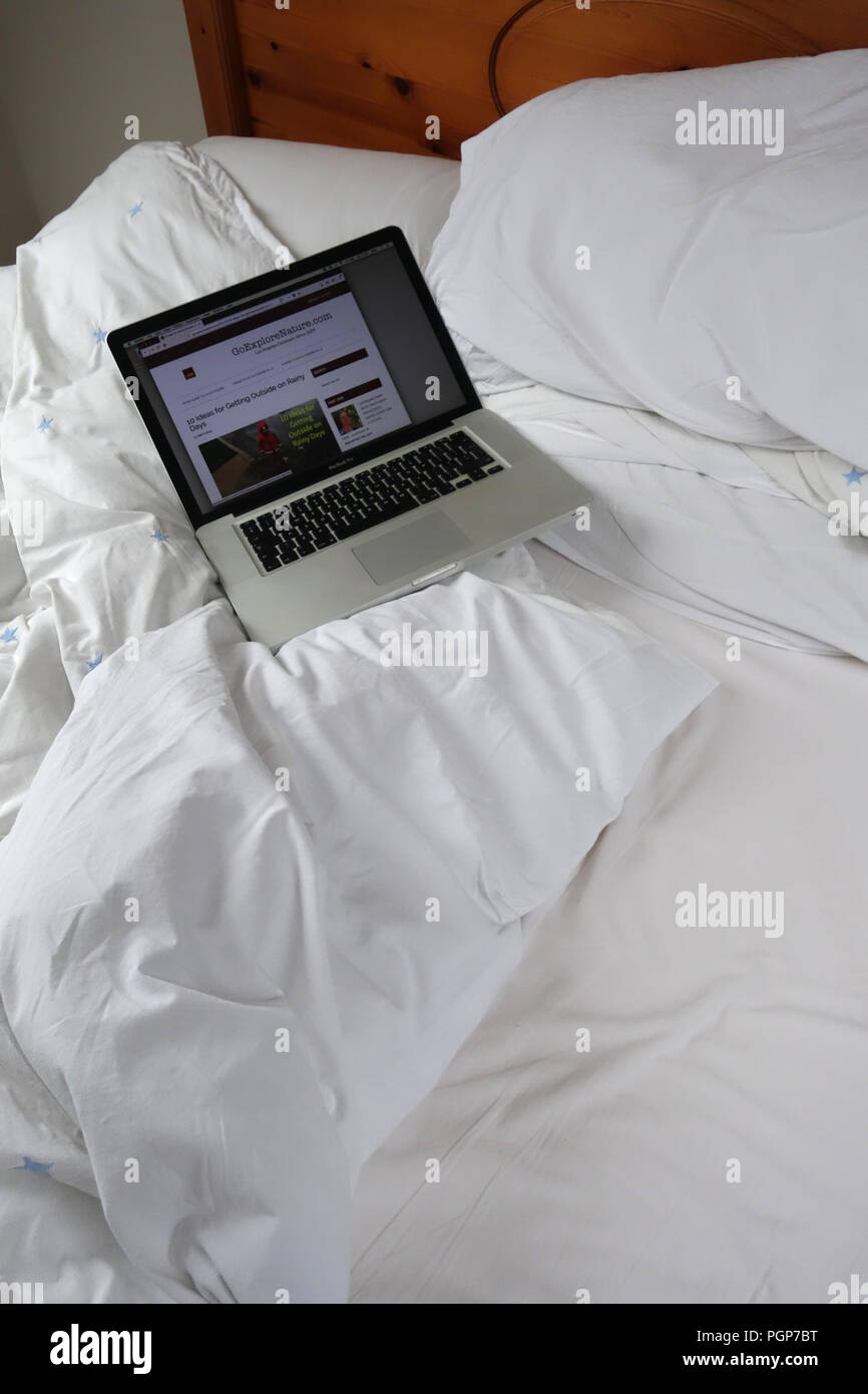 Laptop left on bed hi-res stock photography and images - Alamy