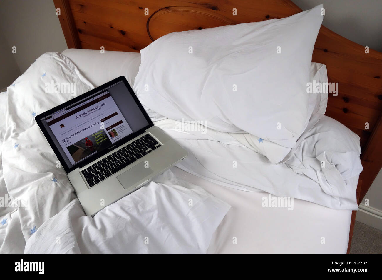 Laptop left on bed hi-res stock photography and images - Alamy