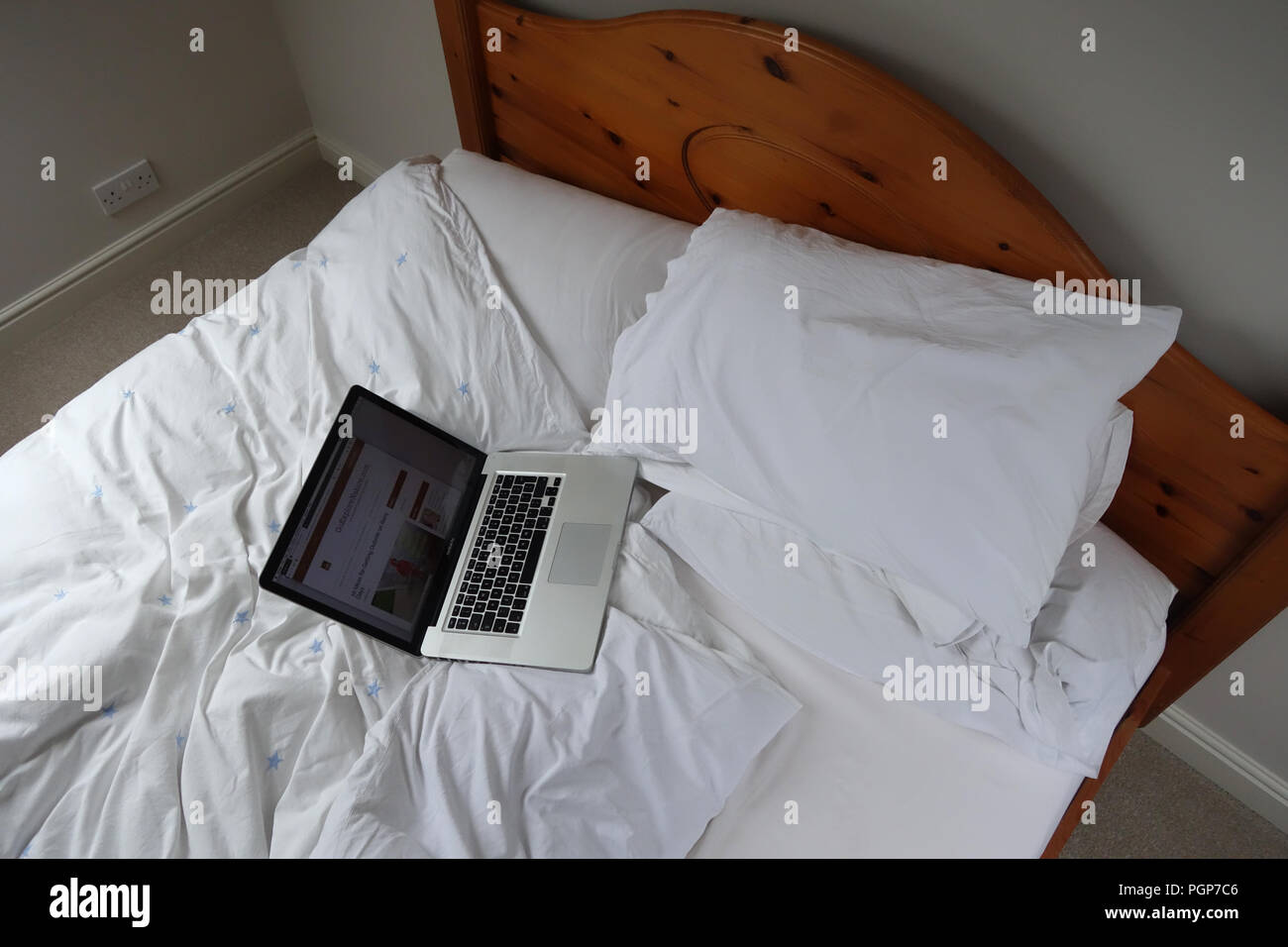 Laptop left on bed hi-res stock photography and images - Alamy