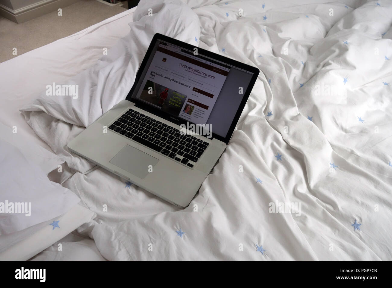 Laptop left on bed hi-res stock photography and images - Alamy
