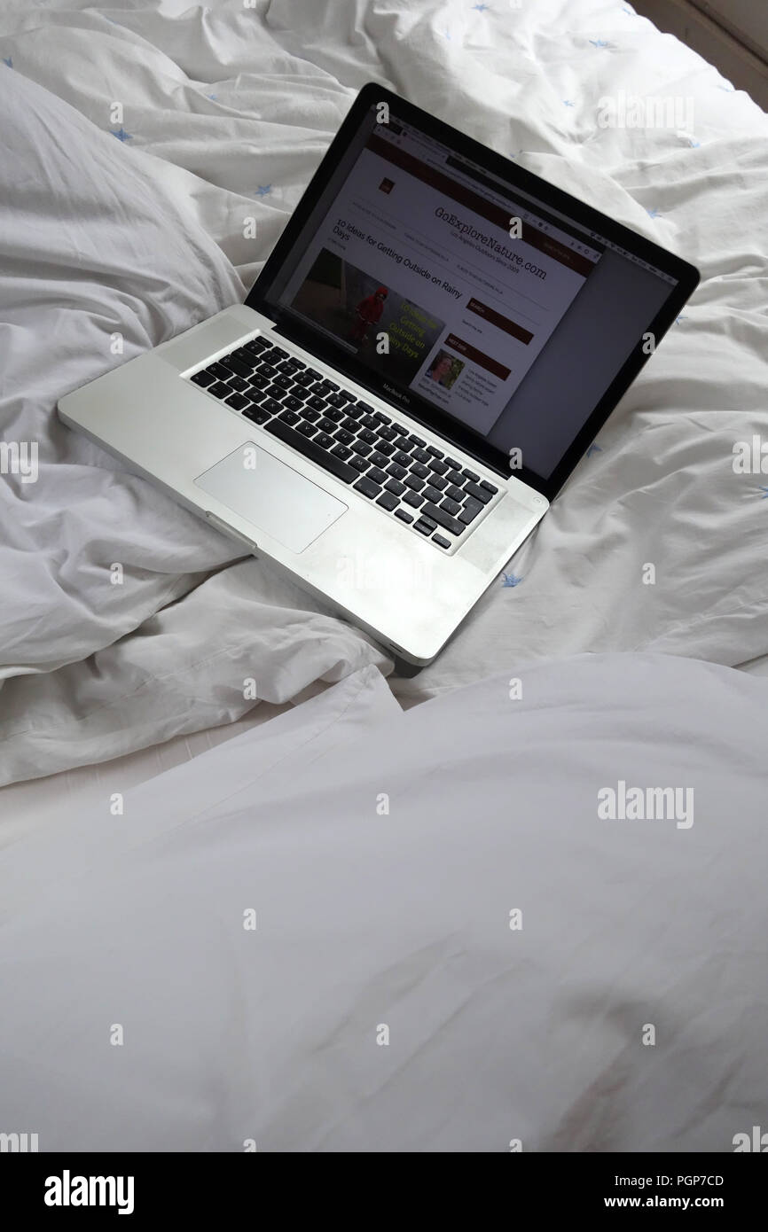 Laptop left on bed hi-res stock photography and images - Alamy