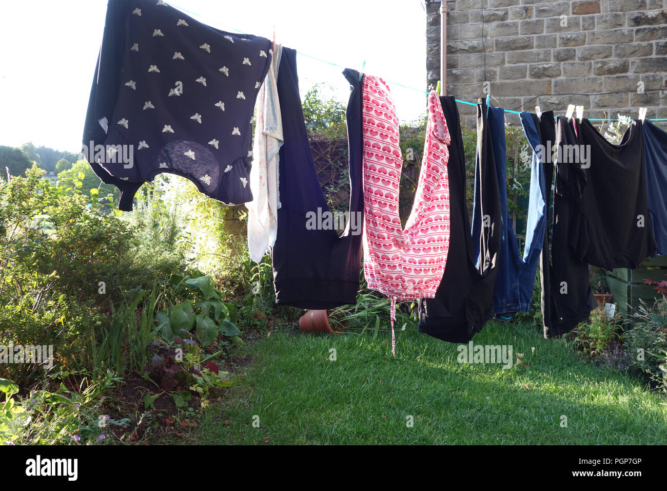 Clothes drying in the wind on a clothes line hi-res stock photography ...