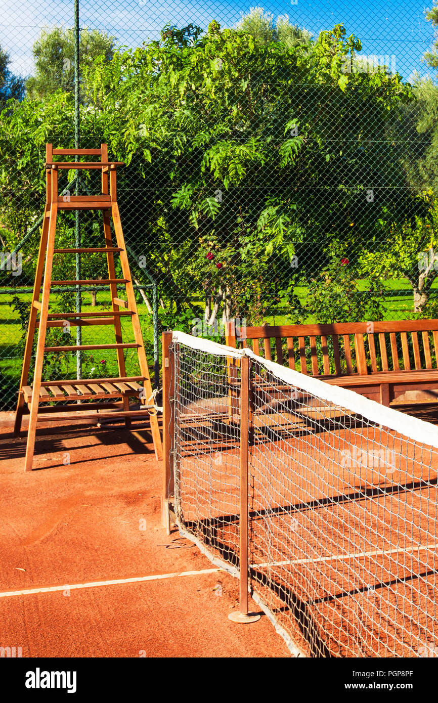 Clay tennis court with wooden umpire stand. Close up view. Upscale ...