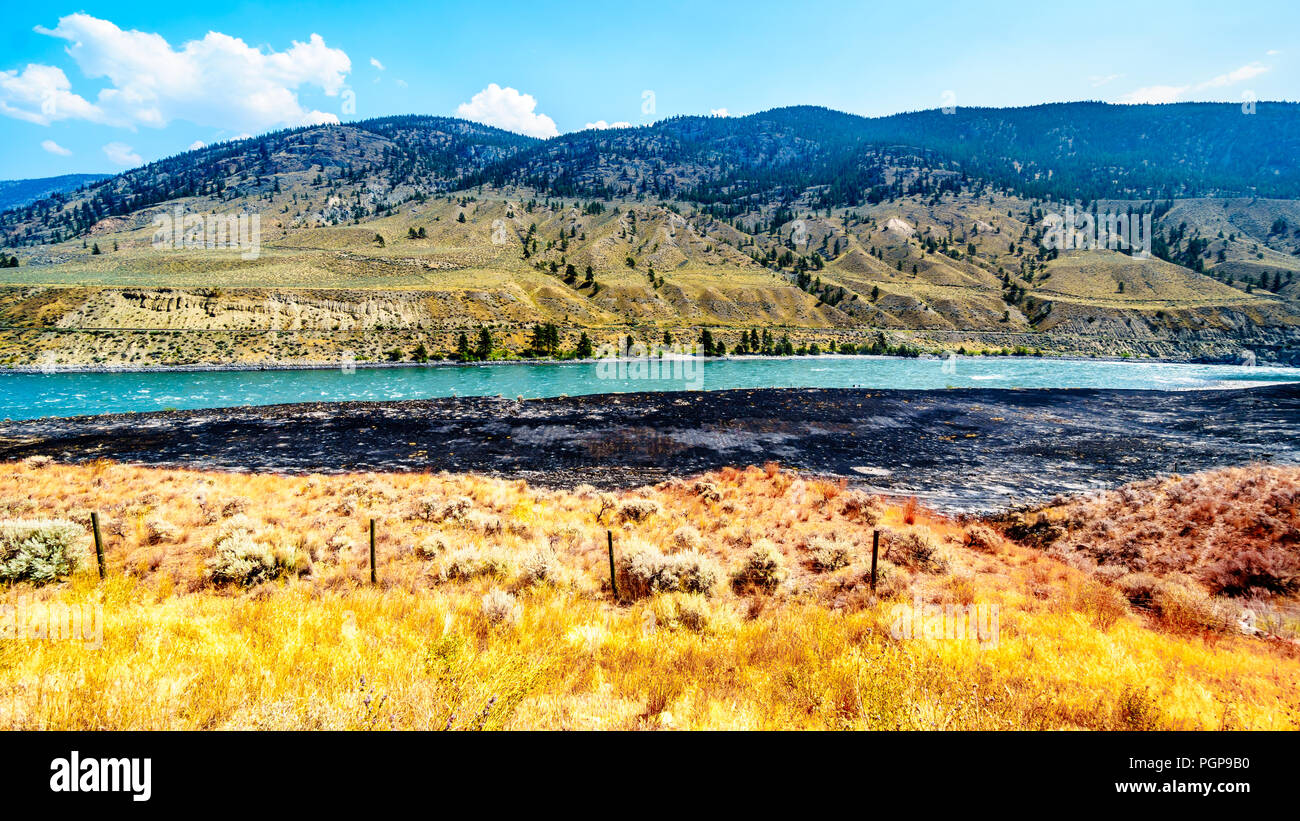 Red Fire Retardant from extinguishing a grass fire colored the hillside ...