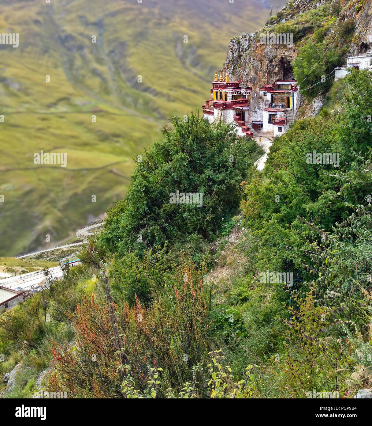 Tibetan Drak Yerpa Buddhist monastery on the cliff in Mountains of ...