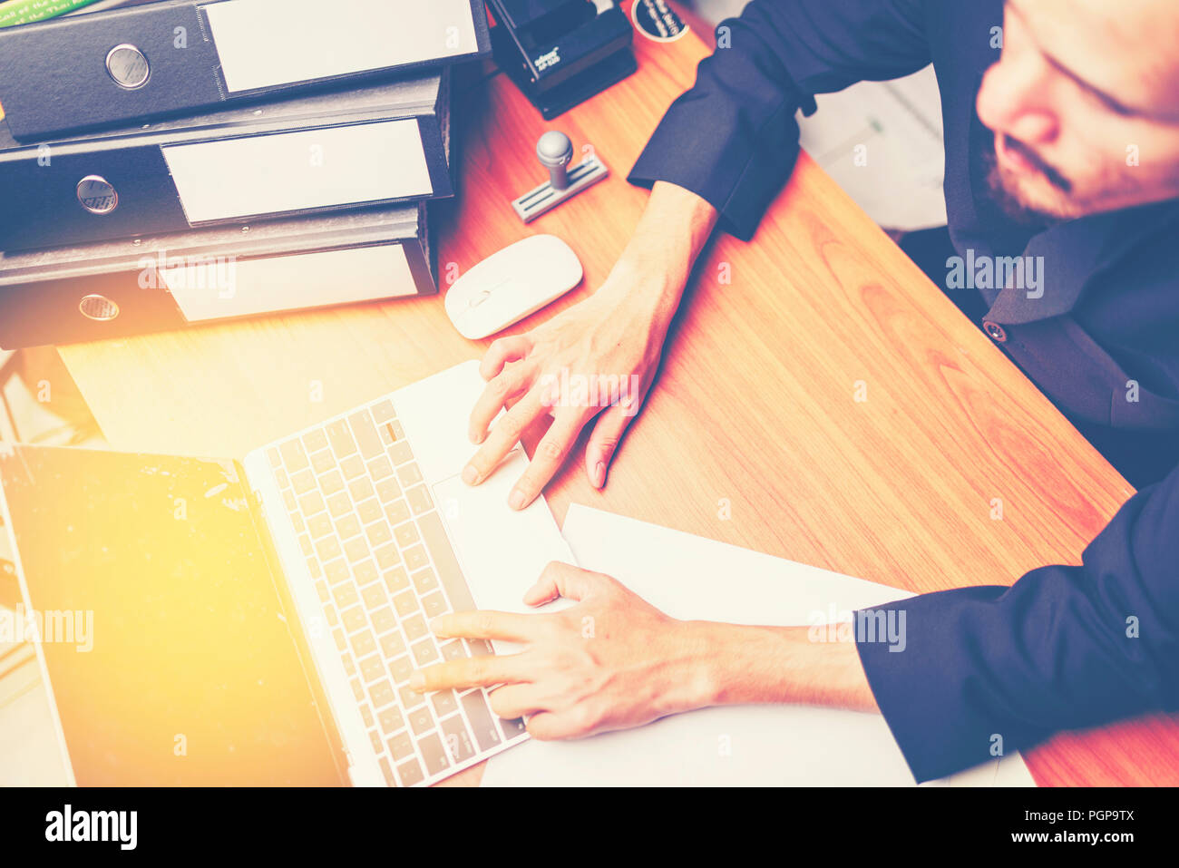 Cropped shot of a man's hands using a laptop at home, rear view of business man hands busy using ...