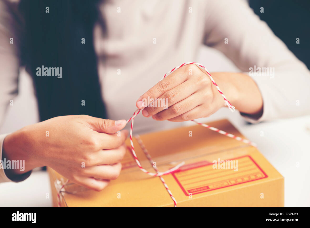 Female hands packing box at warehouse, online marketing concept Stock ...