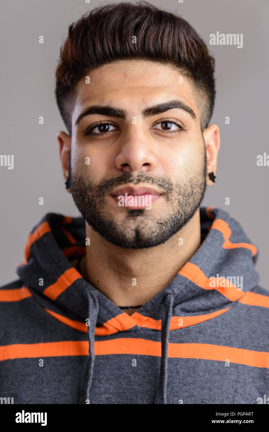 Portrait shot of young handsome Indian man Stock Photo - Alamy