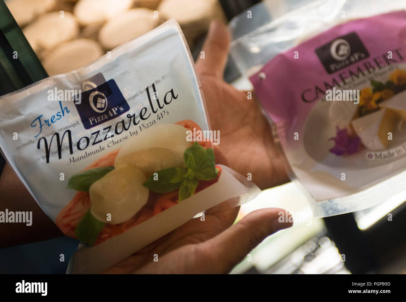 Cheeses made handmade by Pizza 4Ps are on display at the branch in ...