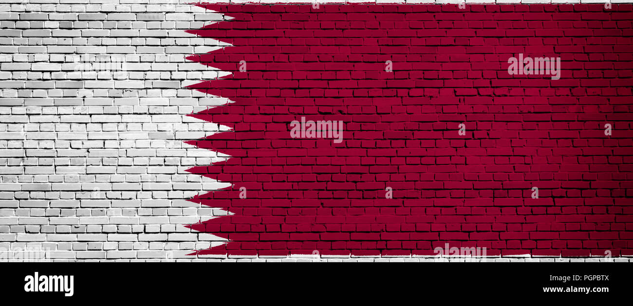 National flag of Qatar on a brick background Stock Photo - Alamy