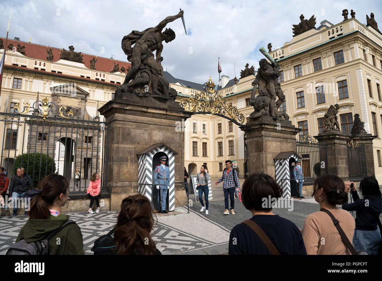 Chinese tourists at Prague Castle and the guards at the entrance in ...