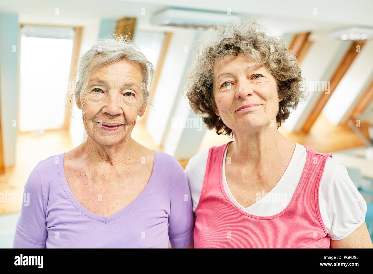 Two senior women as pensioners and girlfriends in the retirement home ...