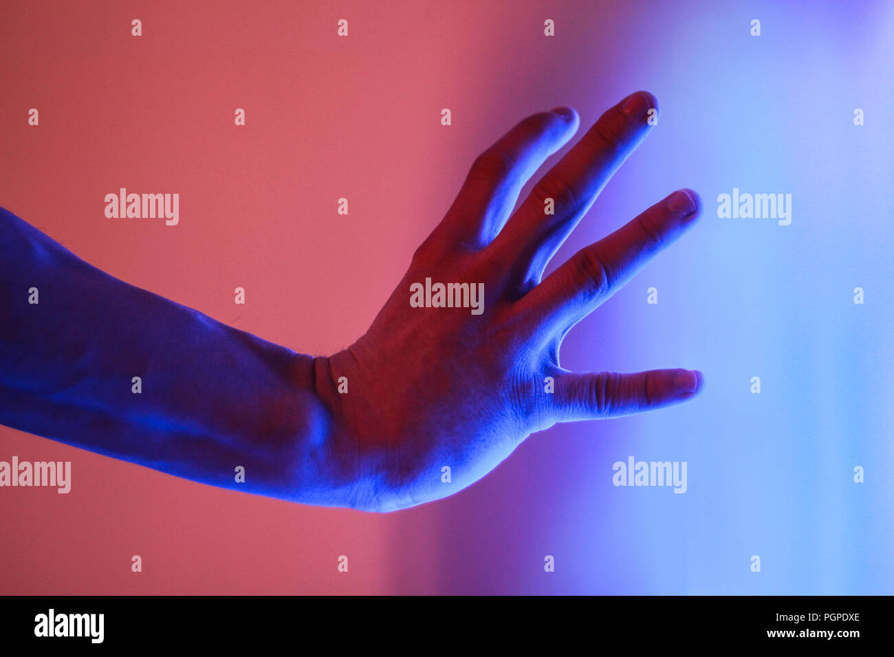 Human hands in red and blue color neon fluorescent light Stock Photo ...