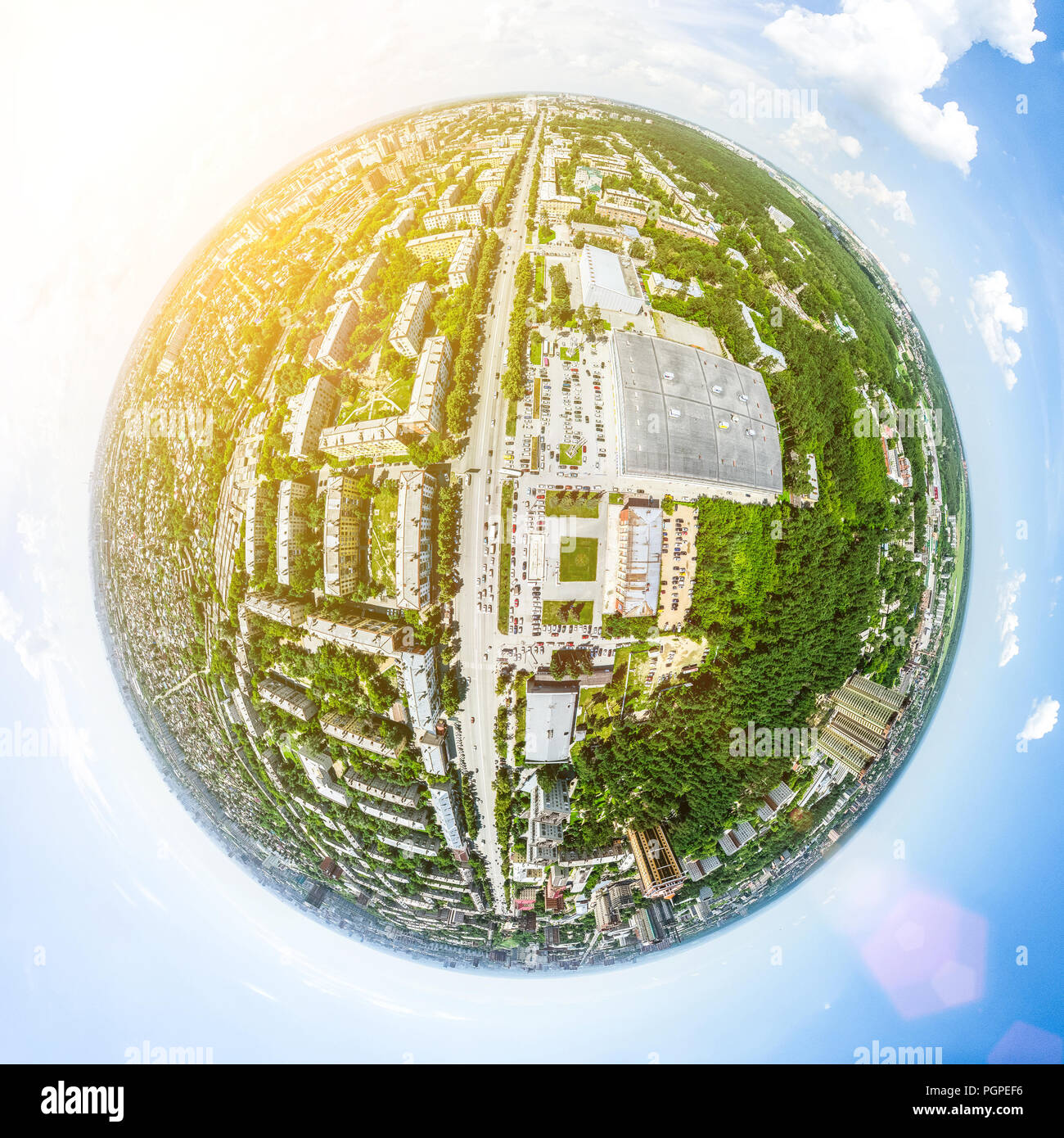 Aerial city view with crossroads and roads, houses, buildings, parks ...