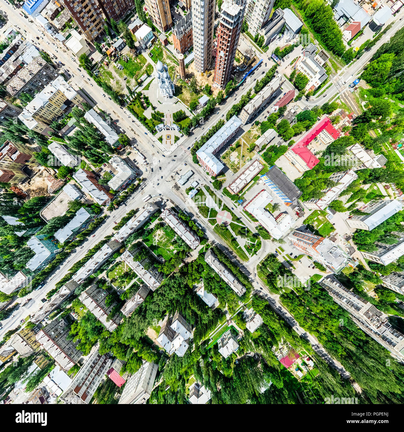 Aerial city view with crossroads and roads, houses, buildings, parks ...