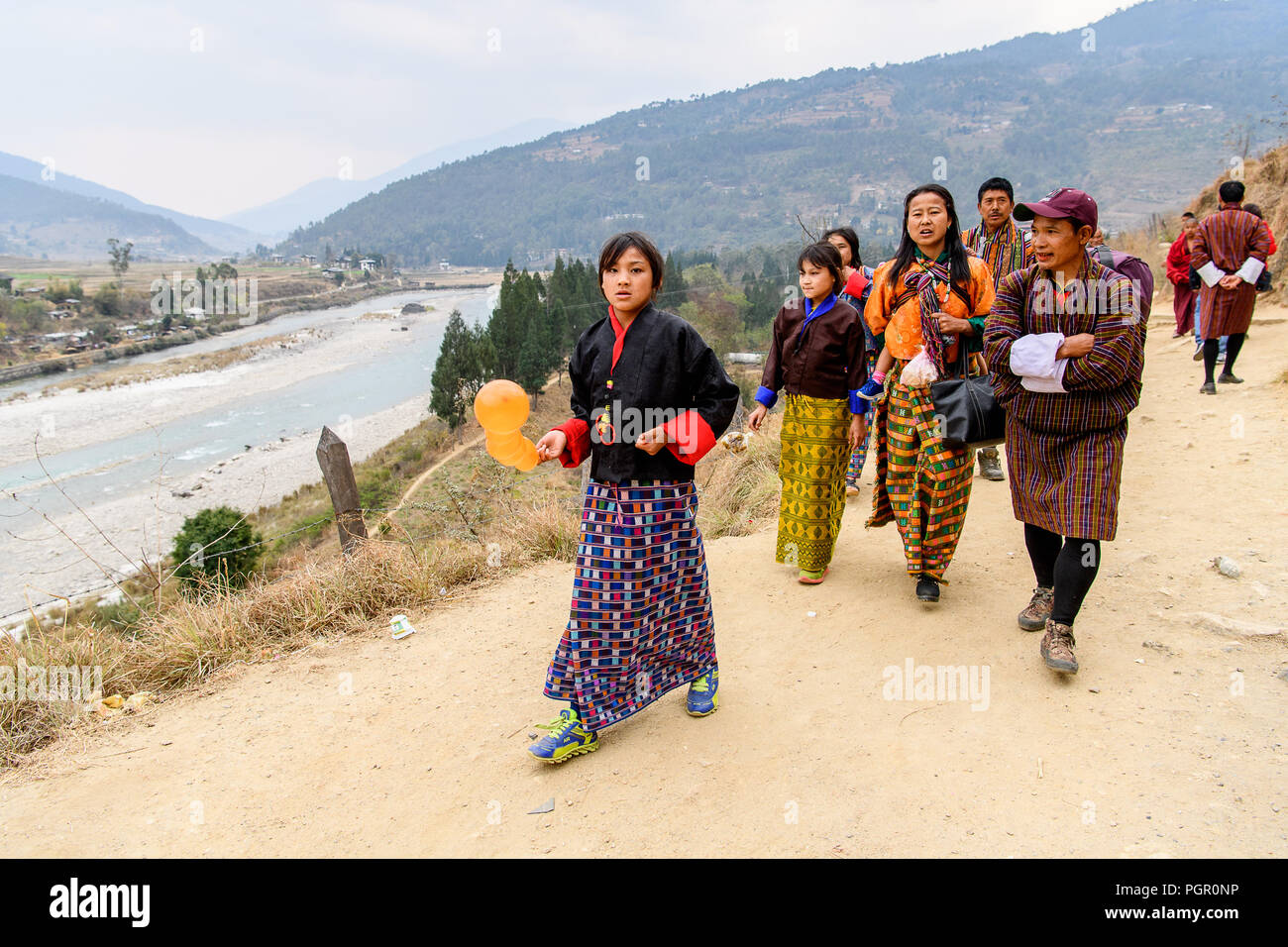 TRIMPHU, BHUTAN - MAR 8, 2017: Unidentified Ngalops people walk along ...