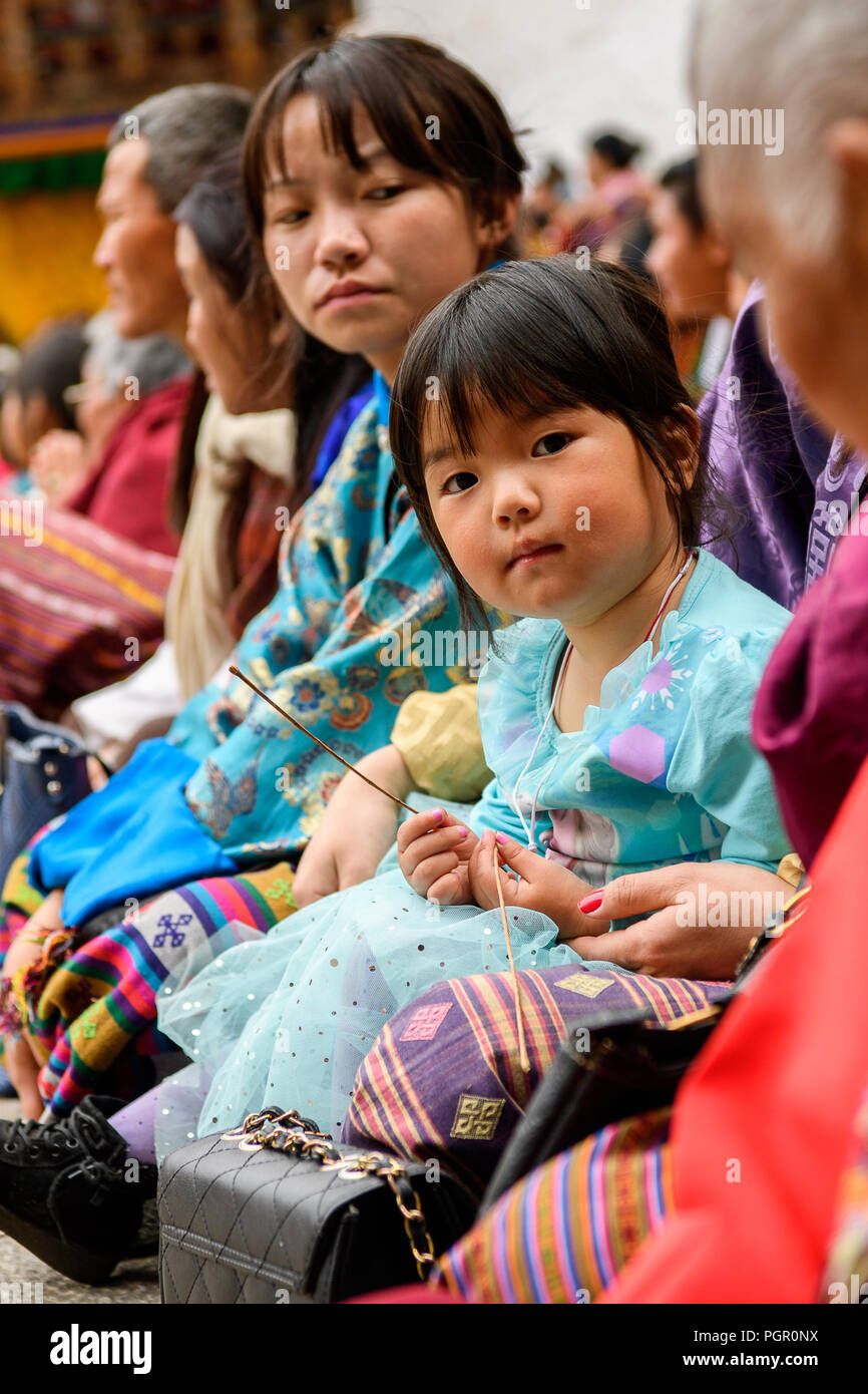 TRIMPHU, BHUTAN - MAR 8, 2017: Unidentified Ngalops little girl sits in ...