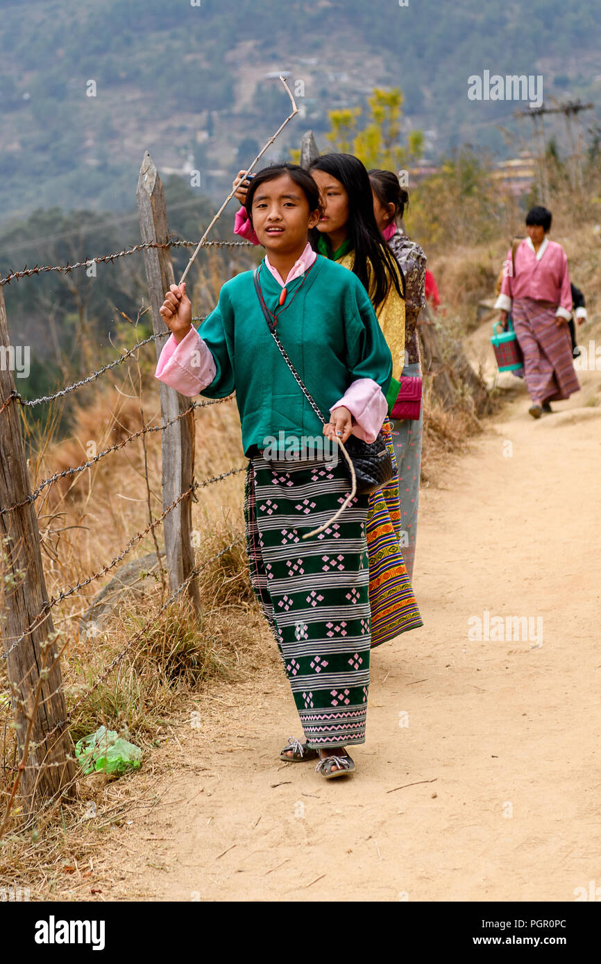 TRIMPHU, BHUTAN - MAR 8, 2017: Unidentified Ngalops people walk along ...