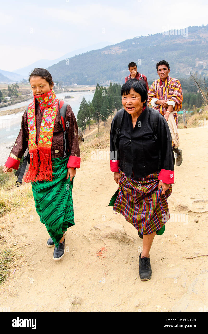 TRIMPHU, BHUTAN - MAR 8, 2017: Unidentified Ngalops people walk along ...