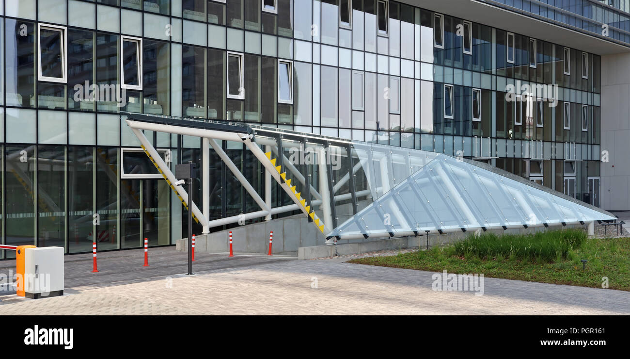 A glass roof above the entrance to the underground car park next to the ...