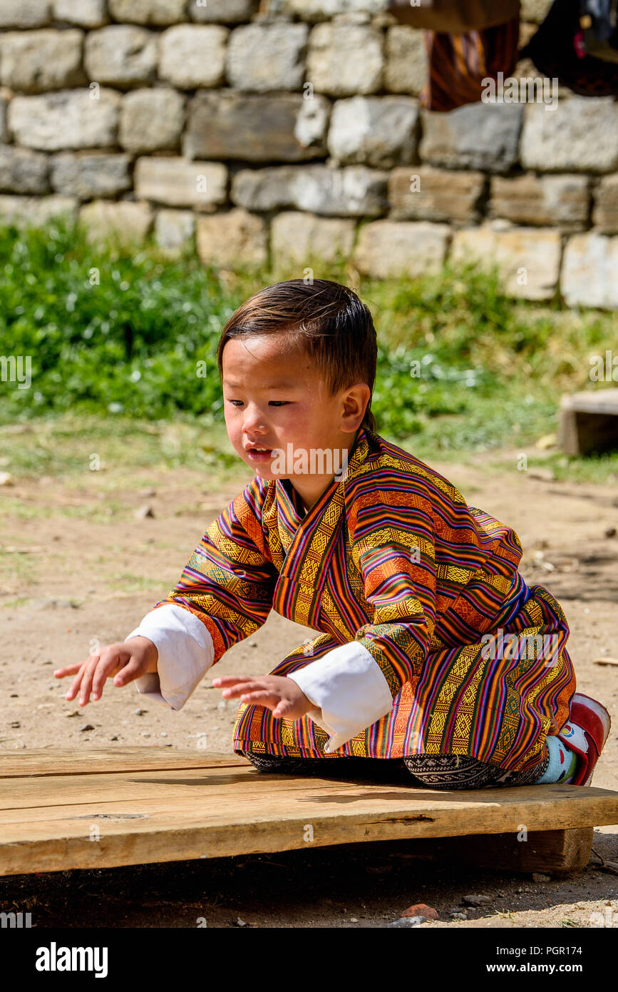 TRIMPHU, BHUTAN - MAR 8, 2017: Unidentified Ngalops little boy plays on ...