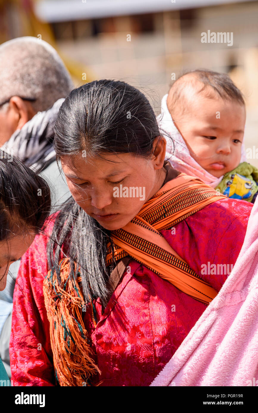 TRIMPHU, BHUTAN - MAR 8, 2017: Unidentified Ngalops woman carries a ...