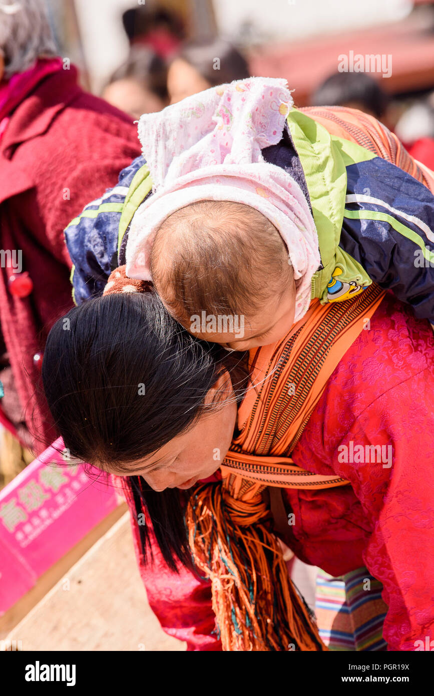 TRIMPHU, BHUTAN - MAR 8, 2017: Unidentified Ngalops woman carries a ...