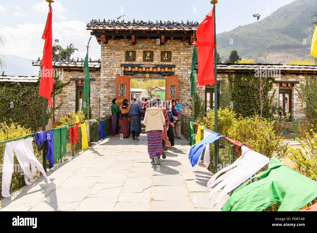TRIMPHU, BHUTAN - MAR 8, 2017: Unidentified Ngalops people walk in a ...
