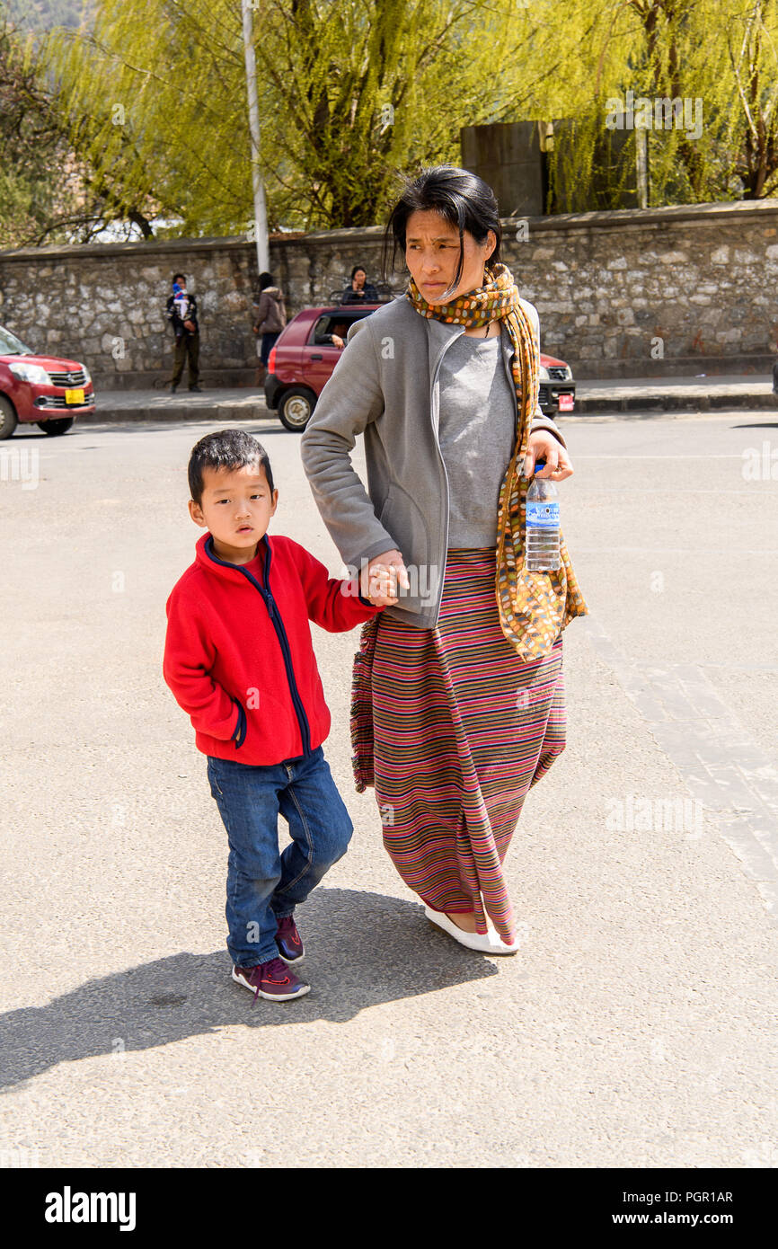 TRIMPHU, BHUTAN - MAR 8, 2017: Unidentified Ngalops woman walks along ...