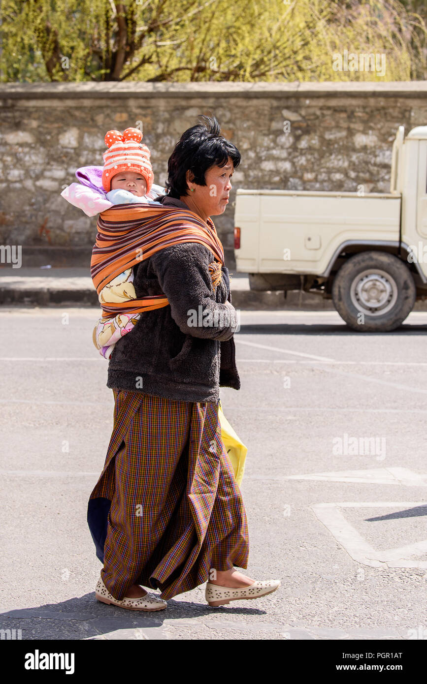 TRIMPHU, BHUTAN - MAR 8, 2017: Unidentified Ngalops woman carries a ...