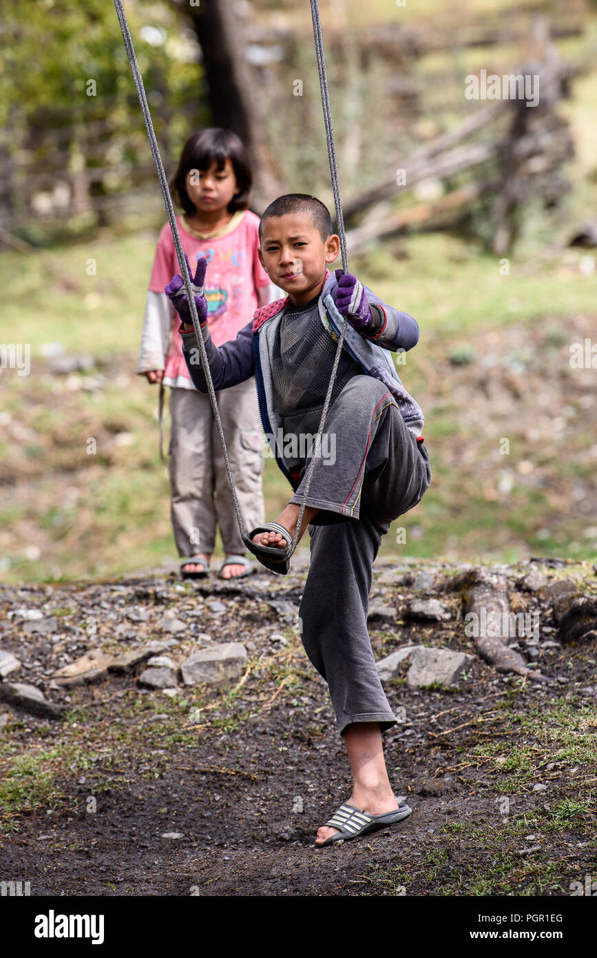 TRIMPHU, BHUTAN - MAR 8, 2017: Unidentified Ngalops little boy holds a ...
