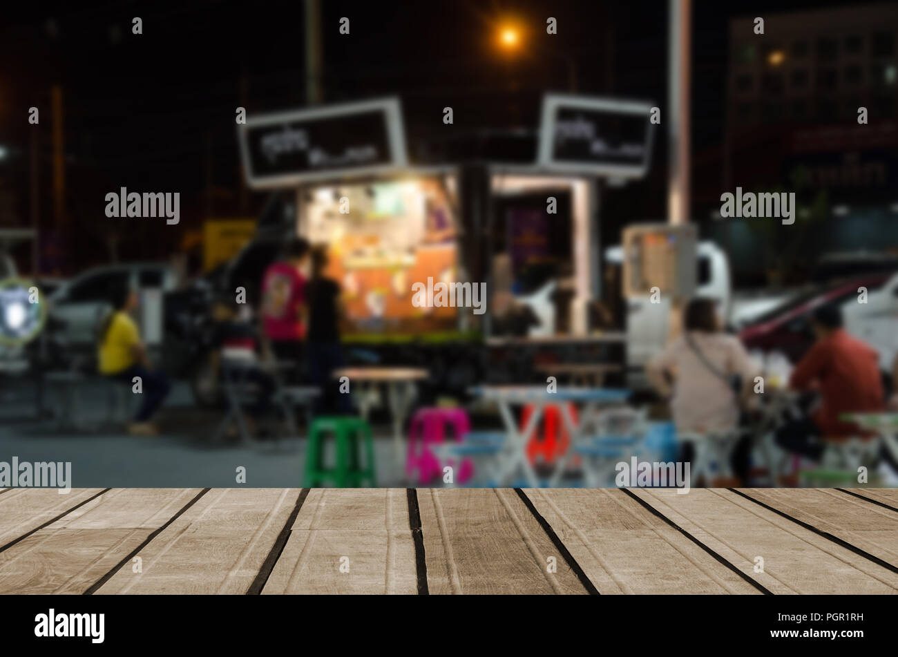 wood table top and Abstract Blurred night market. Can be used for ...
