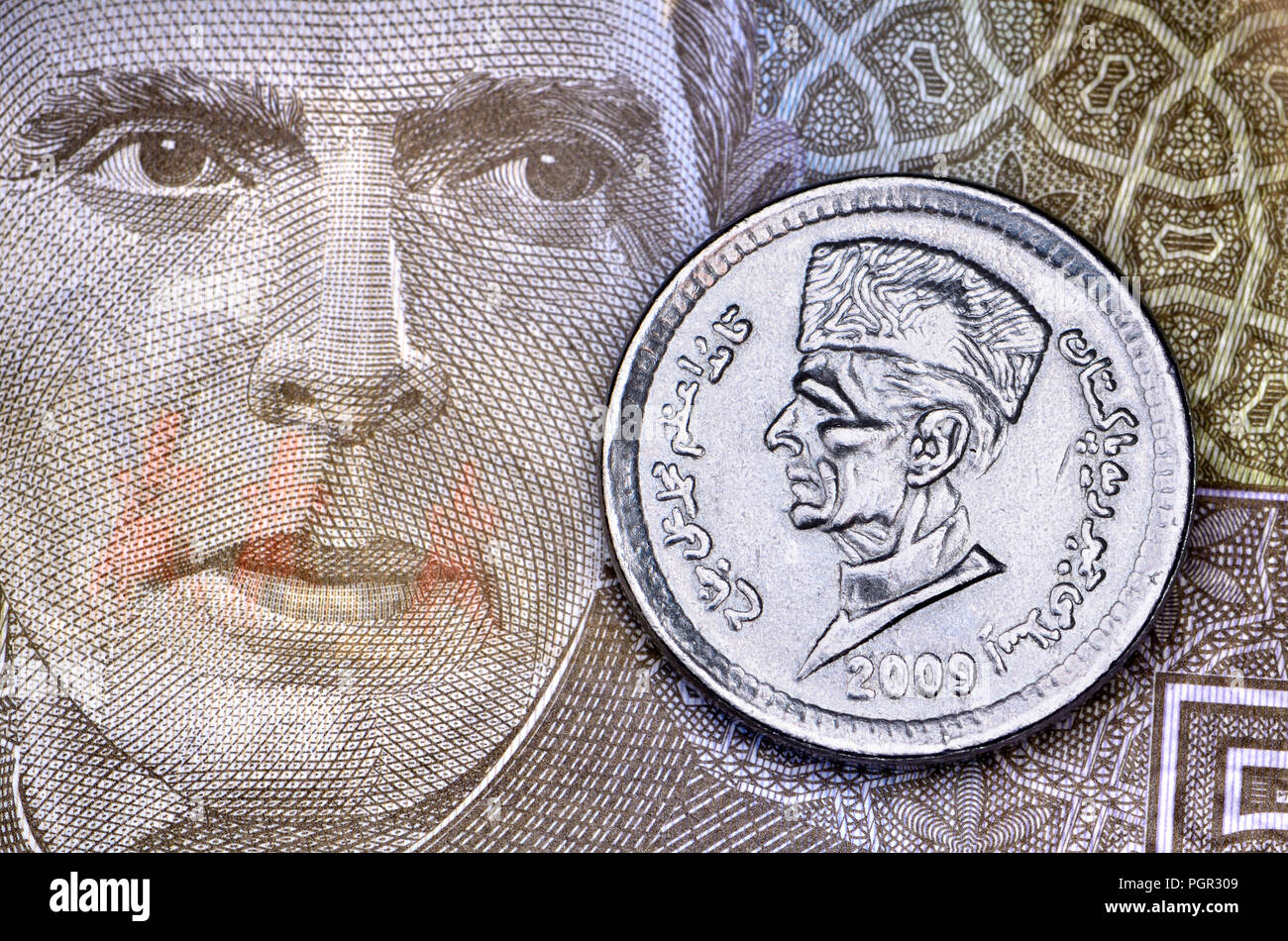 Pakistan 1 Rupee coin (2009) on a 5 Rupee banknote (2009), both showing ...