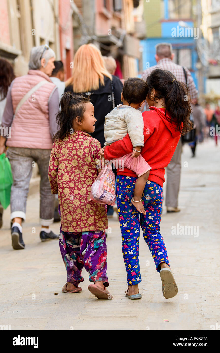 KATMANDU, NEPAL - MAR 6, 2017: Unidentified Chhetri girl in red jamper ...