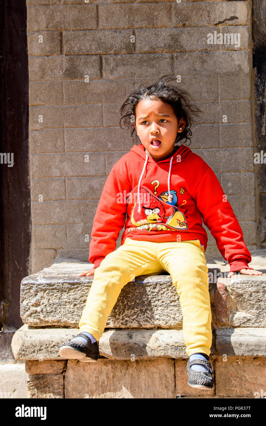 KATMANDU, NEPAL - MAR 6, 2017: Unidentified Chhetri little girl in red ...