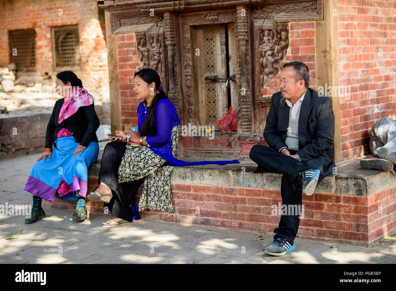 KATMANDU, NEPAL - MAR 6, 2017: Unidentified Chhetri people sit on the ...