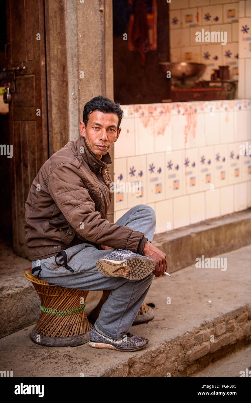 KATMANDU, NEPAL - MAR 6, 2017: Unidentified Chhetri man sits on the ...
