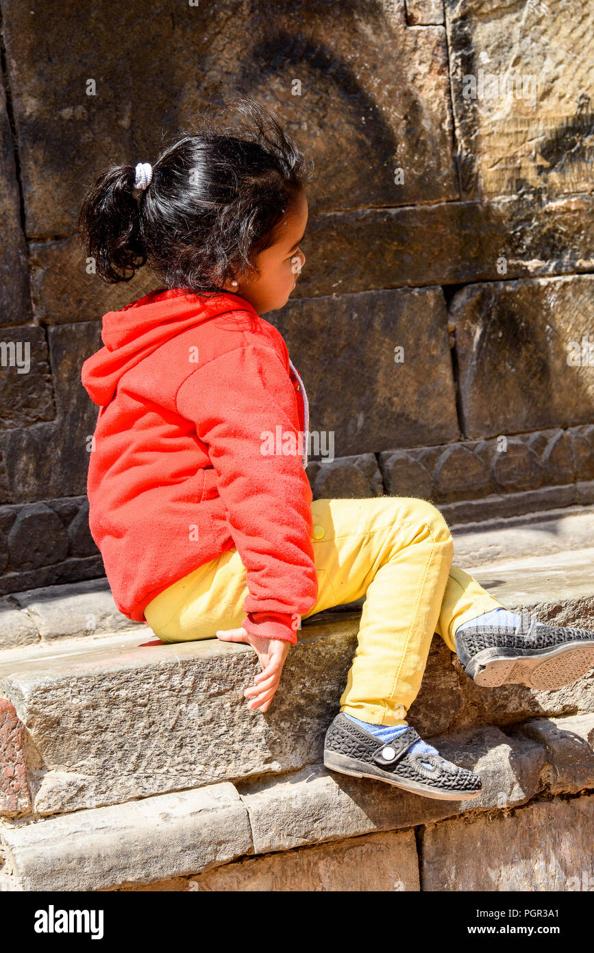 KATMANDU, NEPAL - MAR 6, 2017: Unidentified Chhetri little girl in red ...