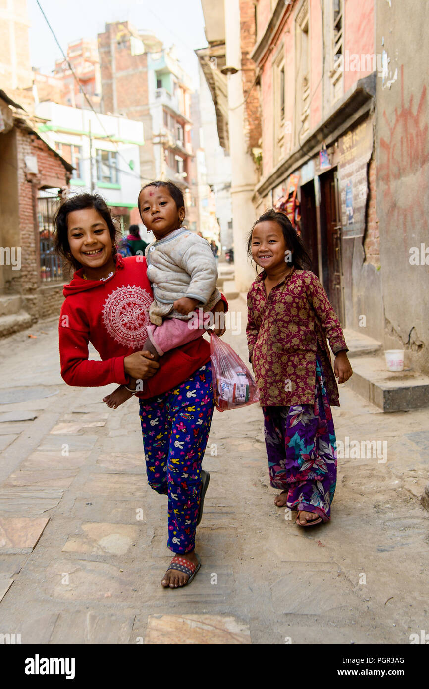 KATMANDU, NEPAL - MAR 6, 2017: Unidentified Chhetri girl in red jamper ...