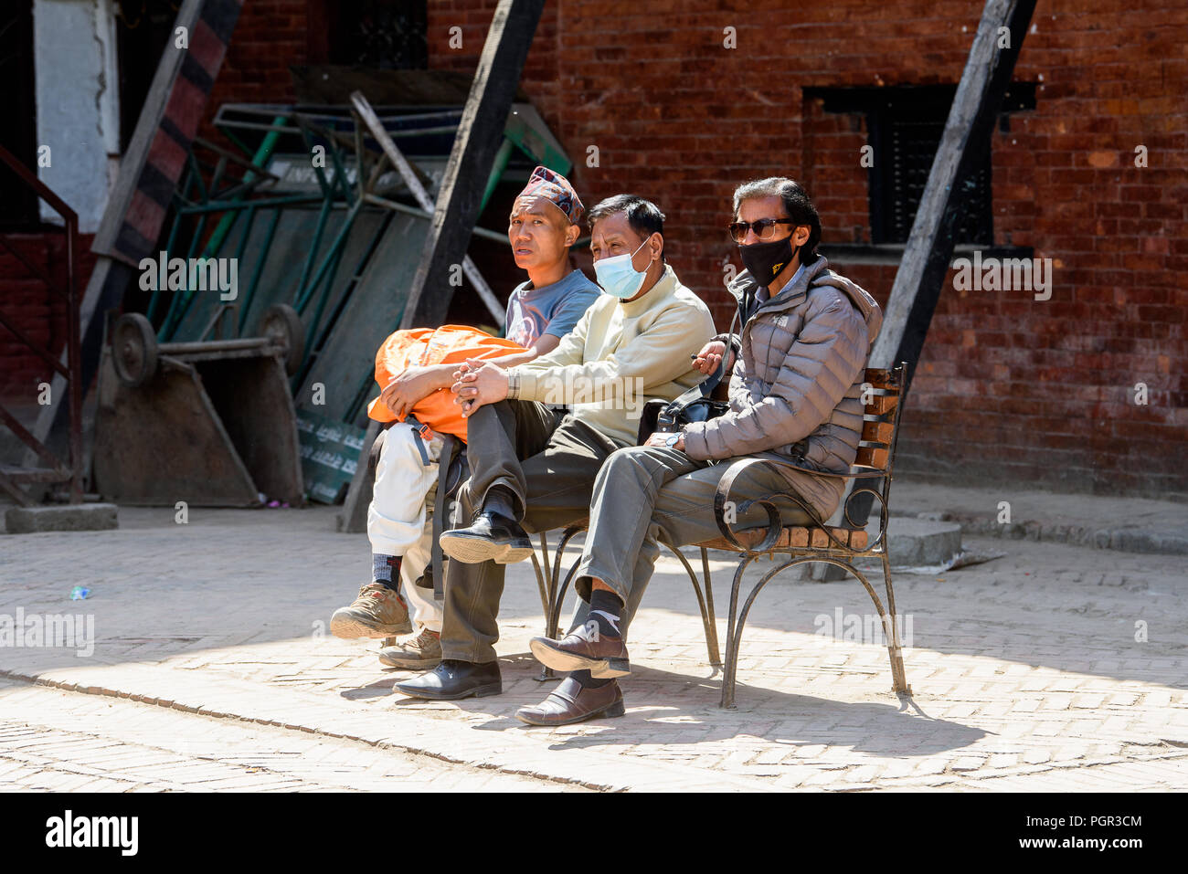 KATMANDU, NEPAL - MAR 6, 2017: Unidentified Chhetri men sit on the ...