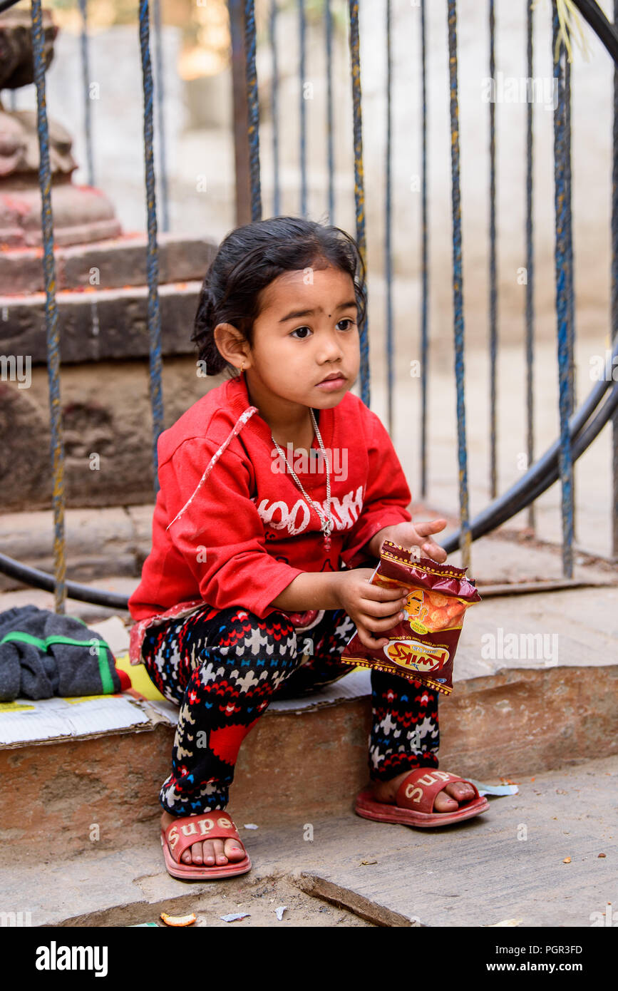 KATMANDU, NEPAL - MAR 6, 2017: Unidentified Chhetri little girl in red ...