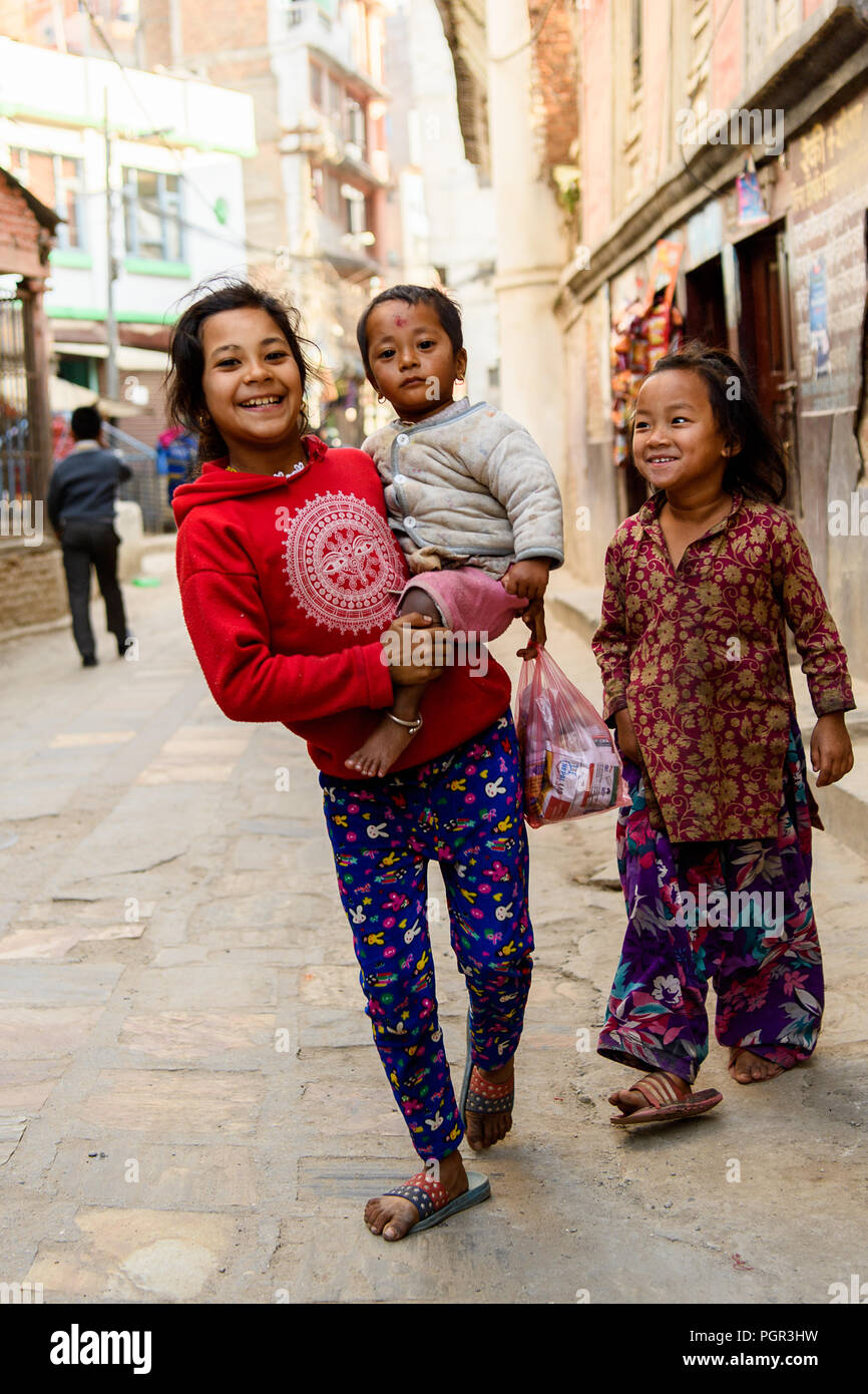 KATMANDU, NEPAL - MAR 6, 2017: Unidentified Chhetri girl in red jamper ...