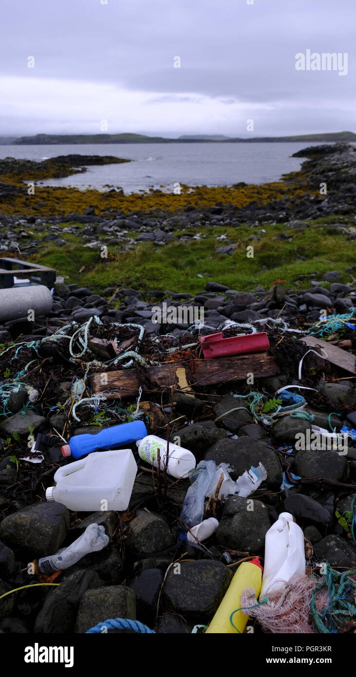 Plastic bottles, cans and containers washed up on the beautiful ...