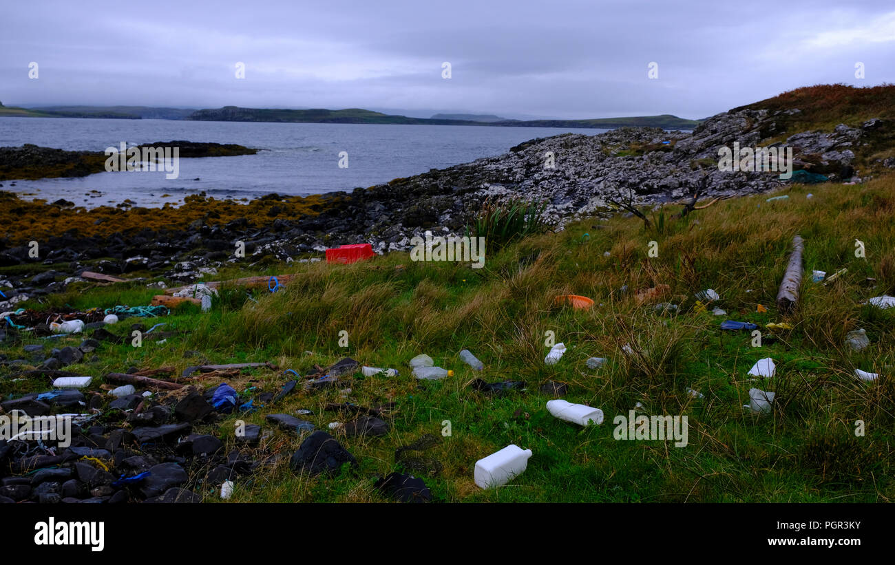 Plastic bottles, cans and containers washed up on the beautiful ...