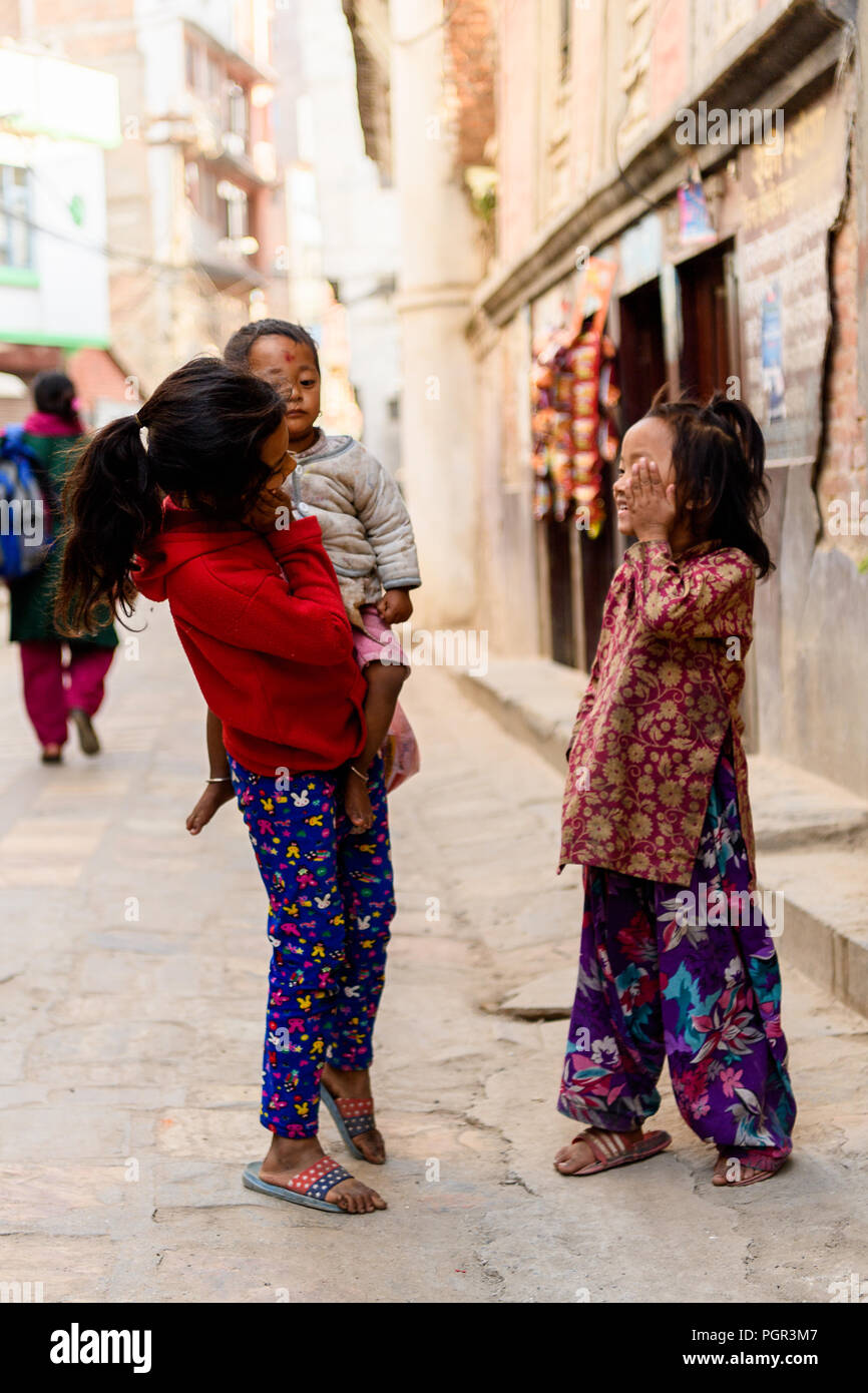 KATMANDU, NEPAL - MAR 6, 2017: Unidentified Chhetri girl in red jamper ...