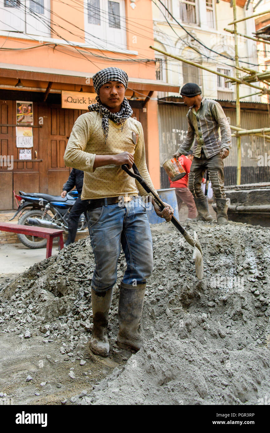 KATMANDU, NEPAL - MAR 6, 2017: Unidentified Chhetri man works with a ...