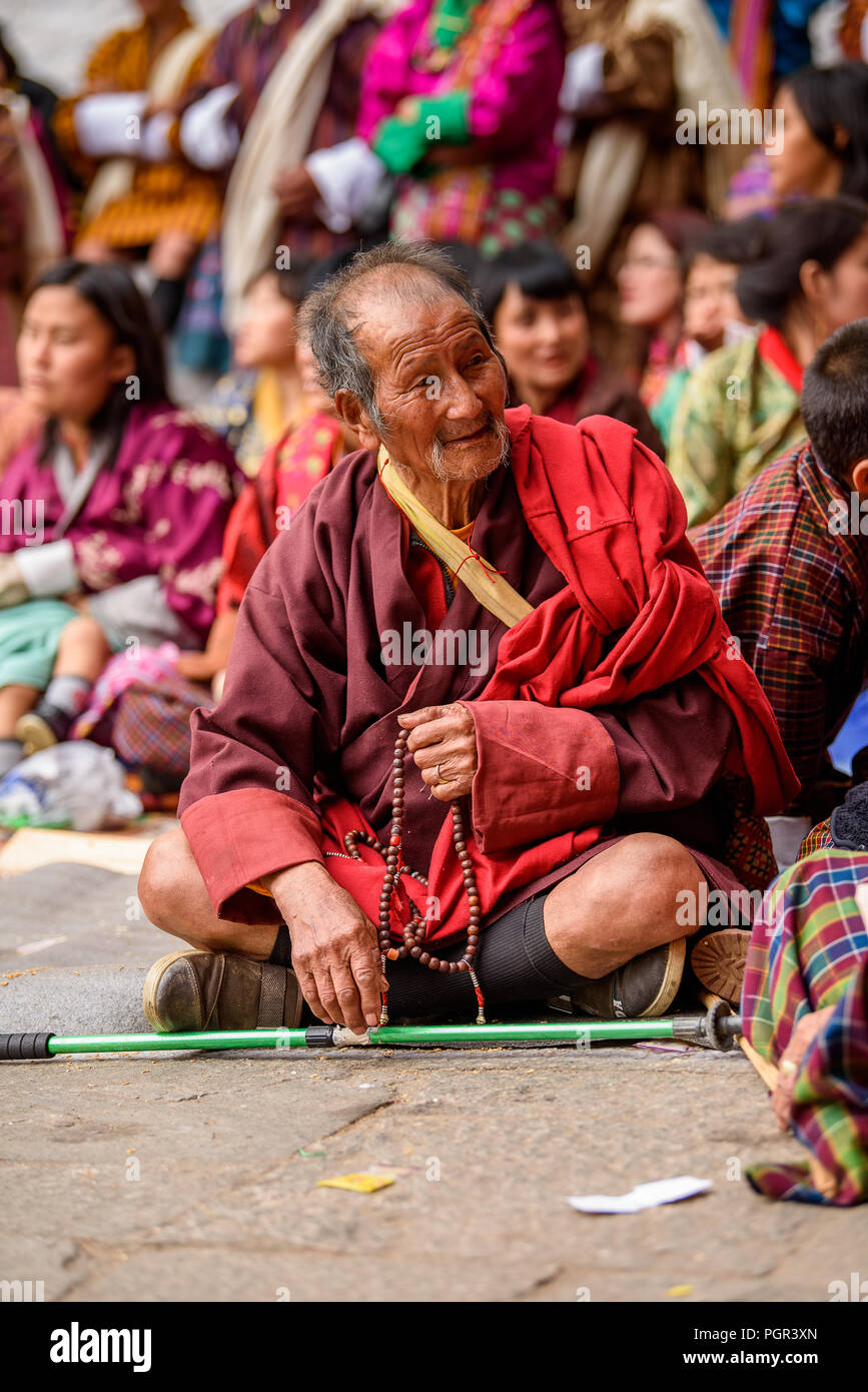 TRIMPHU, BHUTAN - MAR 8, 2017: Unidentified Ngalops old man sits on the ...