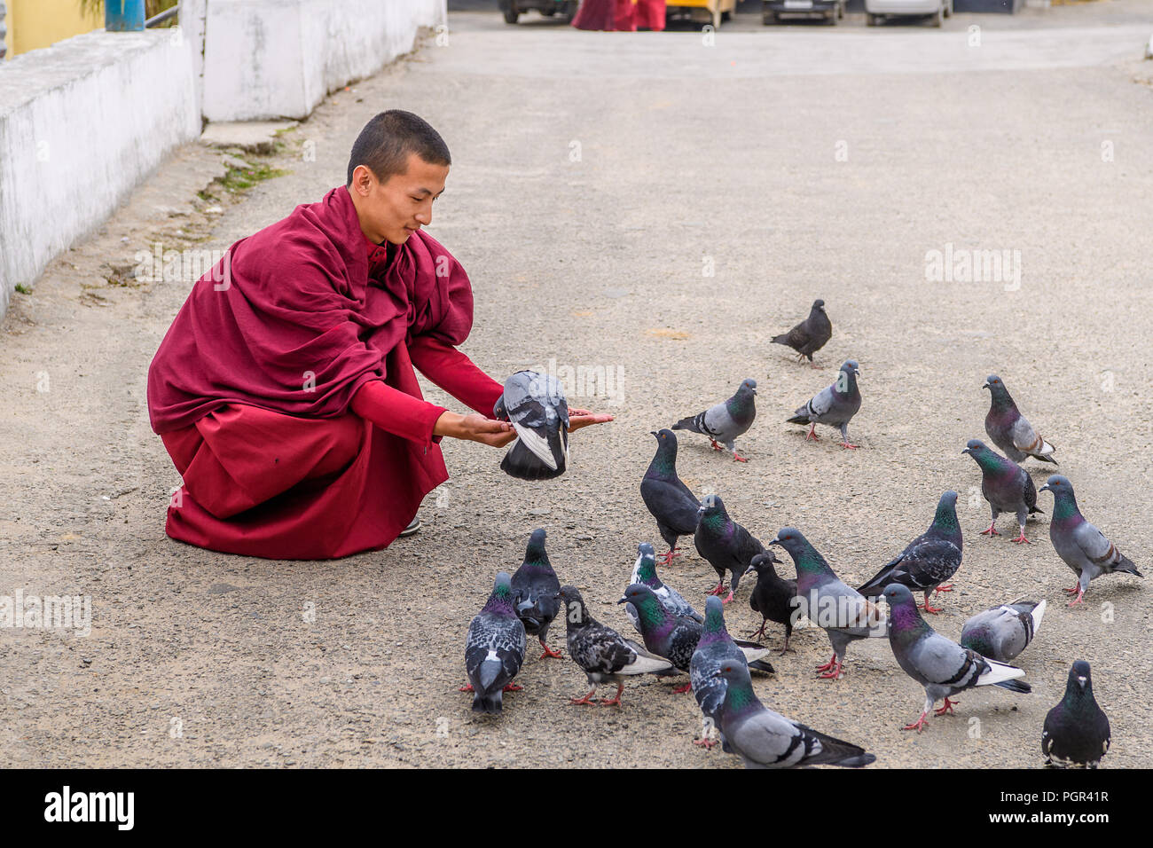 SIKKIM, INDIA - MAR 13, 2017: Unidentified Indian man in red long ...