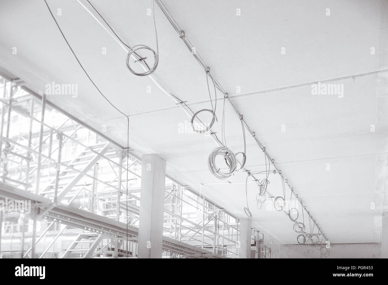 B&W site construction with hanging power cords Stock Photo - Alamy